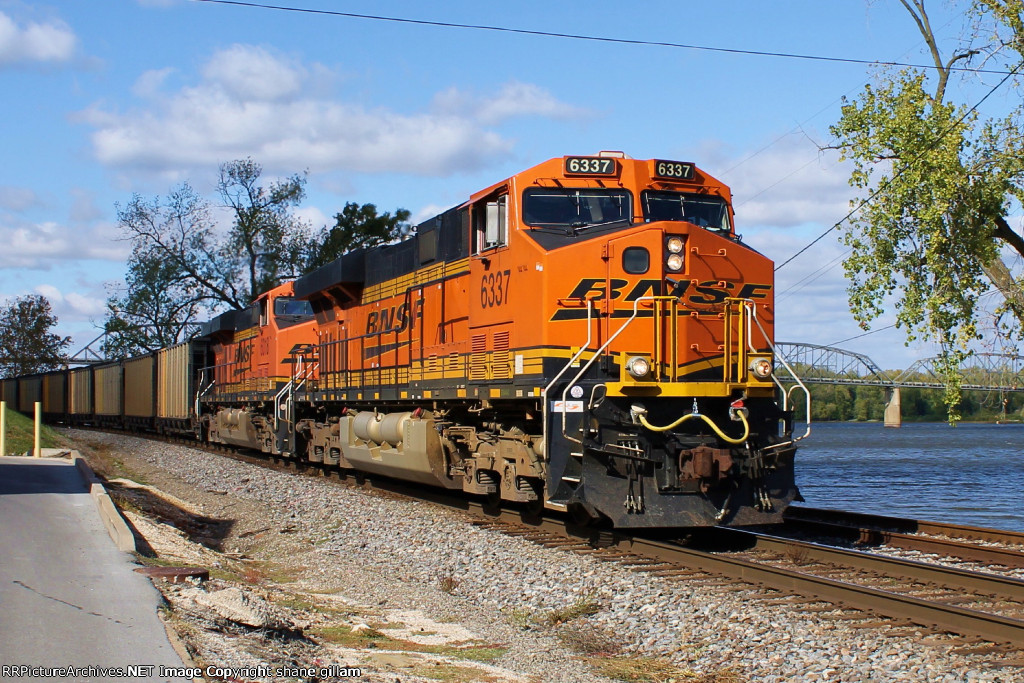 BNSF 6337 takes a coal load south bound down the river.